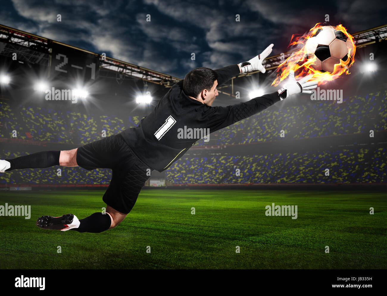 Soccer or football keeper catching ball Stock Photo - Alamy