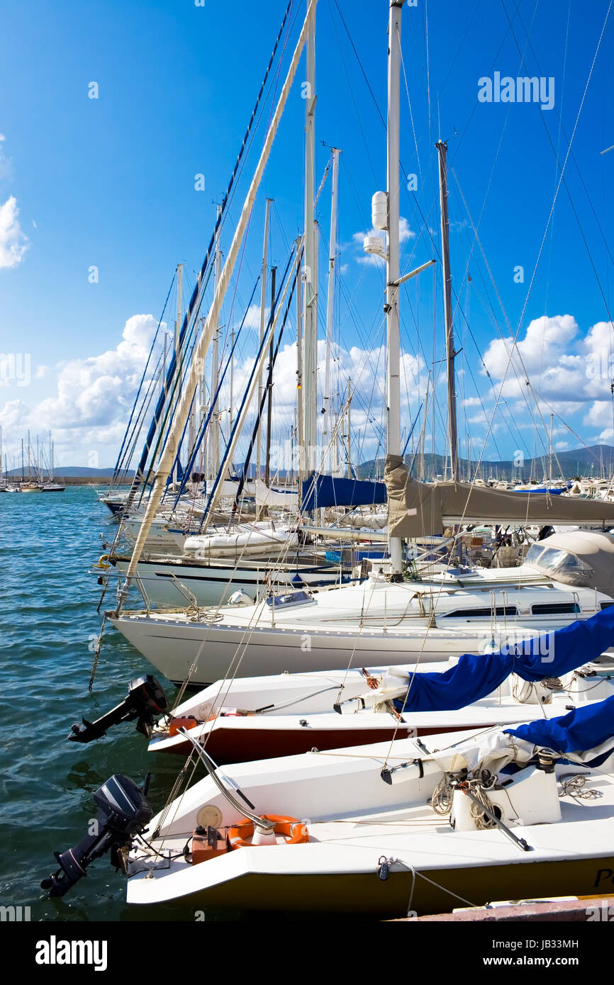 Classic white yachts ancored in Alghero, Sardinia Stock Photo - Alamy