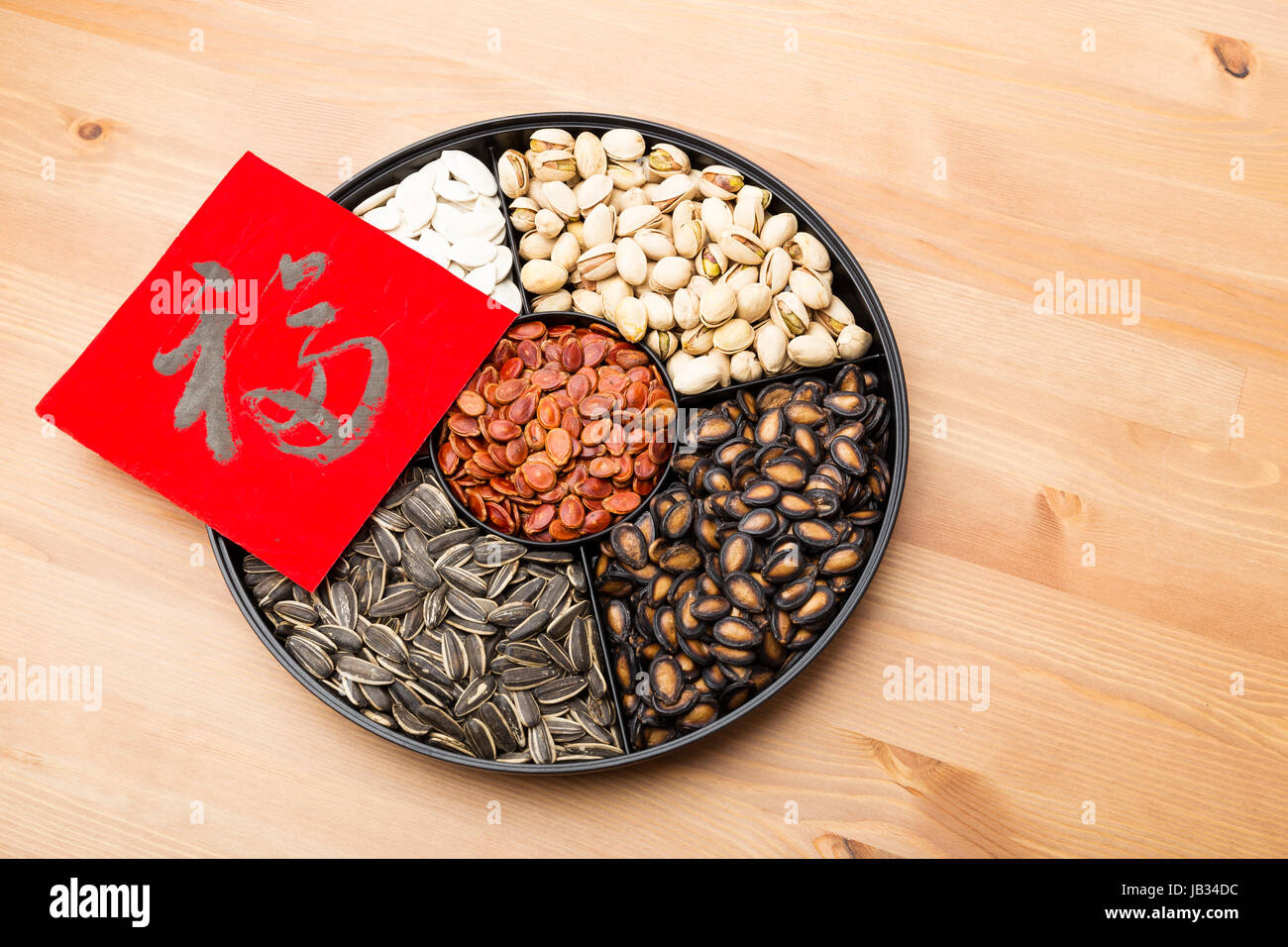 Assorted Chinese Sytle Snack Tray And Chinese Calligraphy Meaning For Blessing Good Luck Stock assorted-chinese-sytle-snack-tray-and-chinese-calligraphy-meaning-for-blessing-good-luck-stock