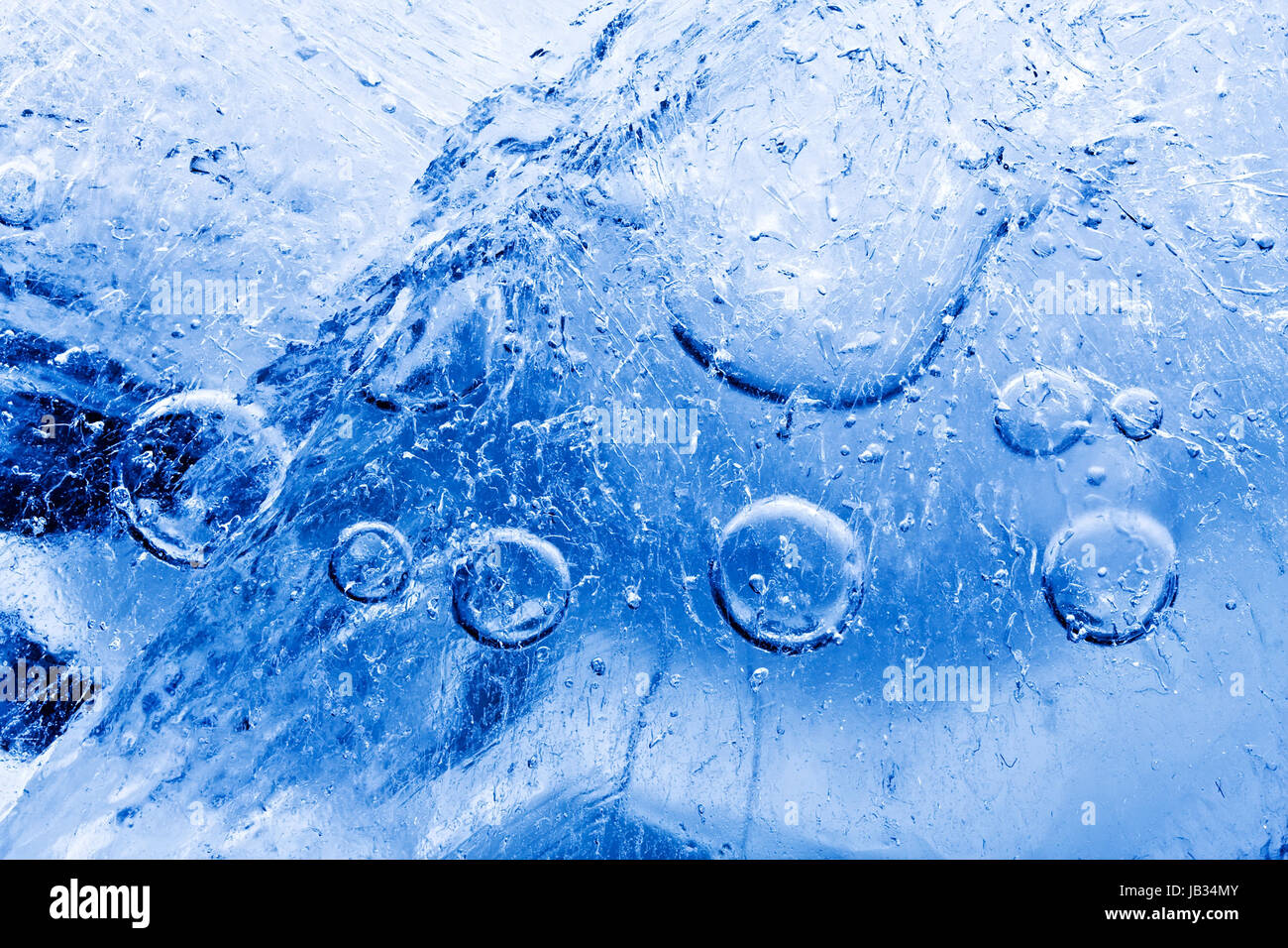 Blue ice with air bubbles background Stock Photo - Alamy