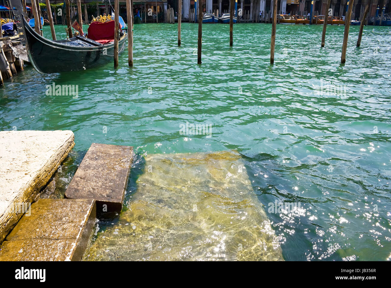 Typical venetian canal and nice gondola, Venice, Italy Stock Photo - Alamy