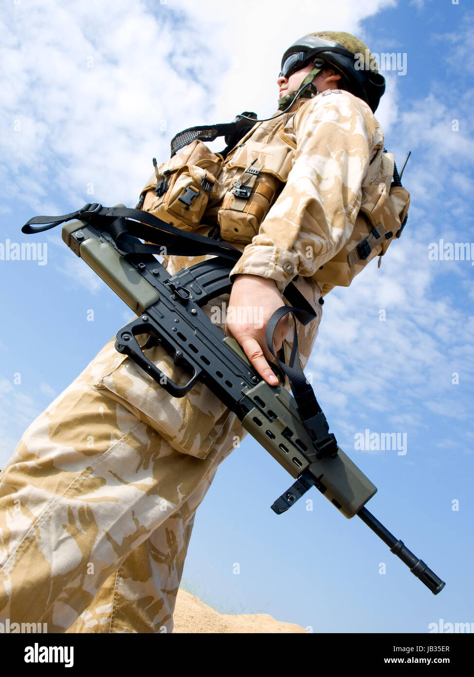 British Royal Commando in desert uniform holding his rifle Stock Photo ...
