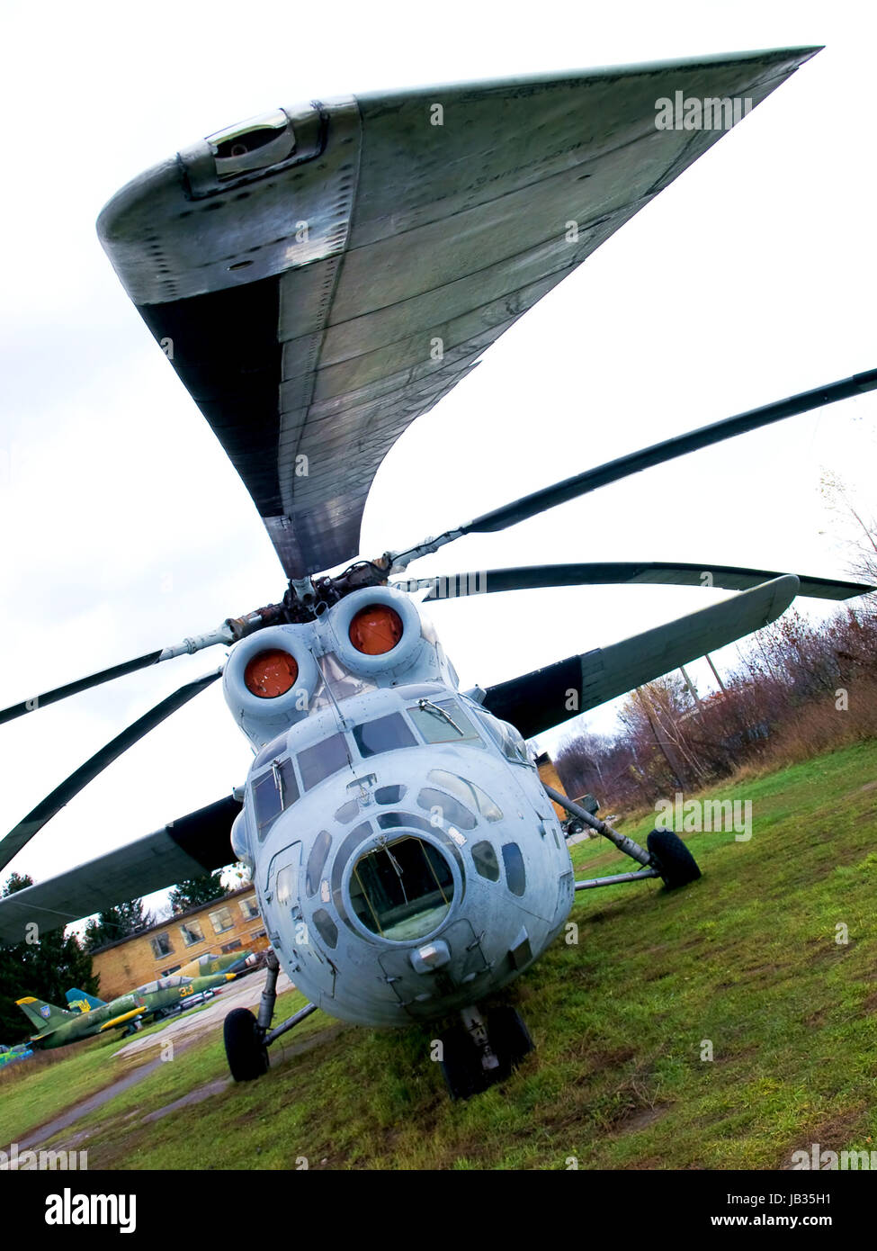 old helicopter parked in grass airfield Stock Photo - Alamy