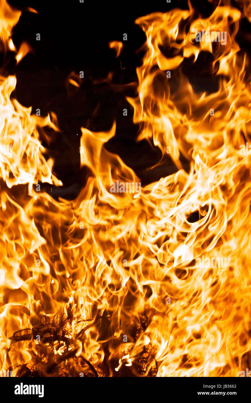 Bright flame burning on black background Stock Photo - Alamy