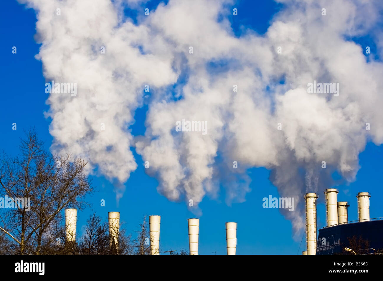 Factory with chimneys and white smoke, Moscow Stock Photo - Alamy