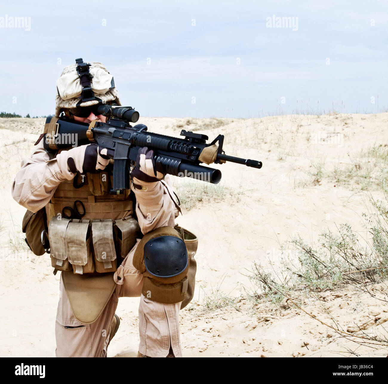 US marine in the desert through the military operation Stock Photo - Alamy