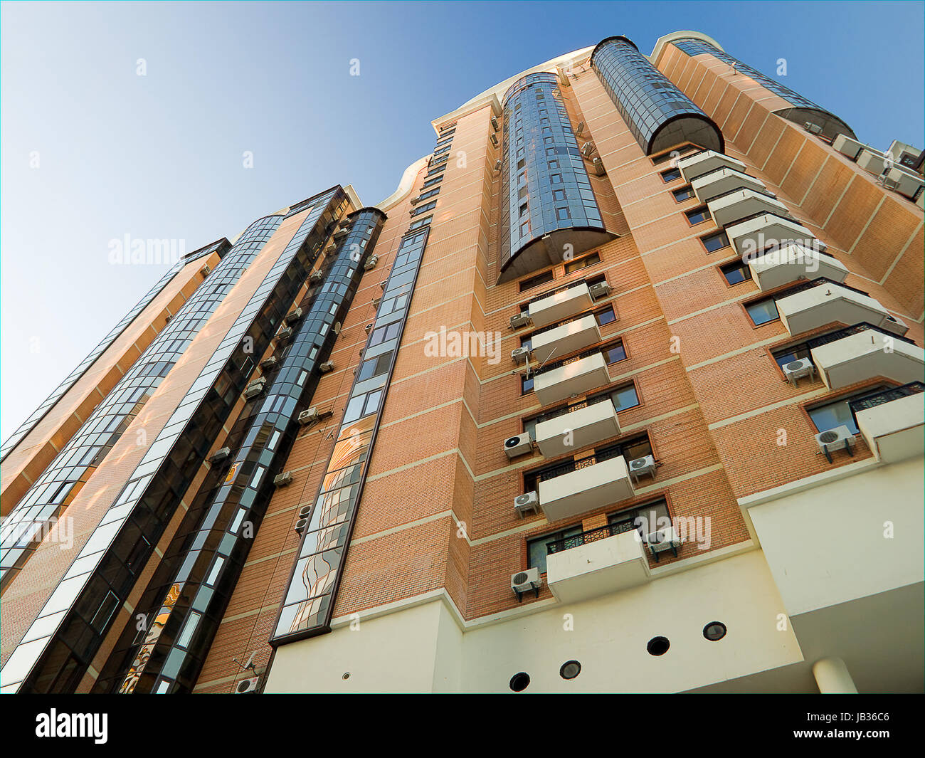 high residential building on a blue background Stock Photo - Alamy