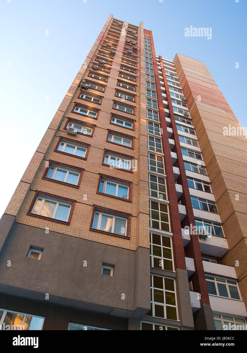 high residential building on a blue background Stock Photo - Alamy