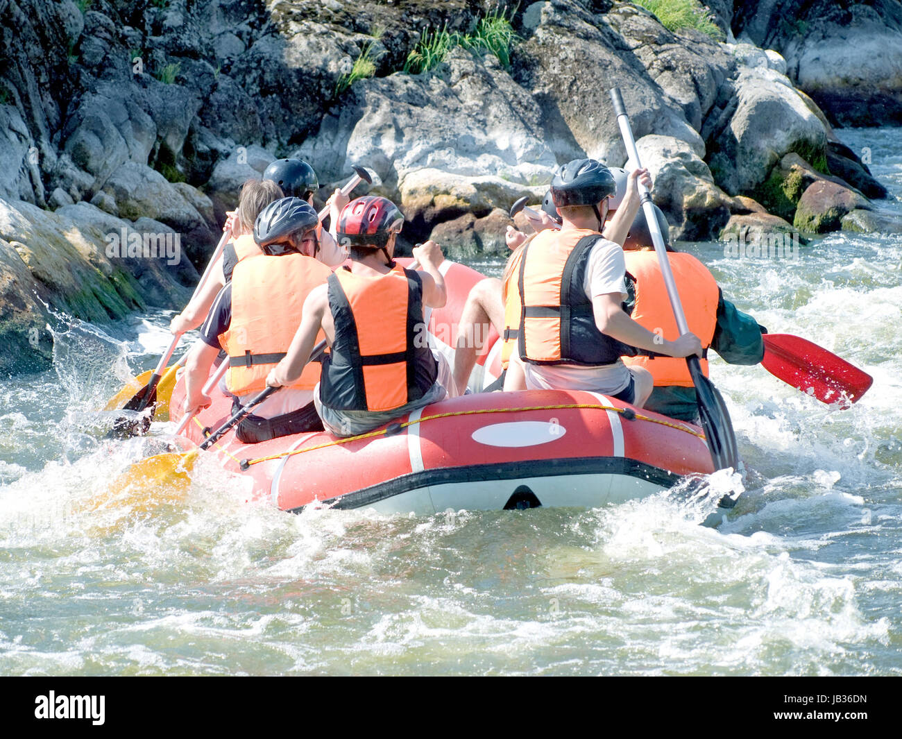 group of people in a rafting boat, rowing on the river Stock Photo - Alamy