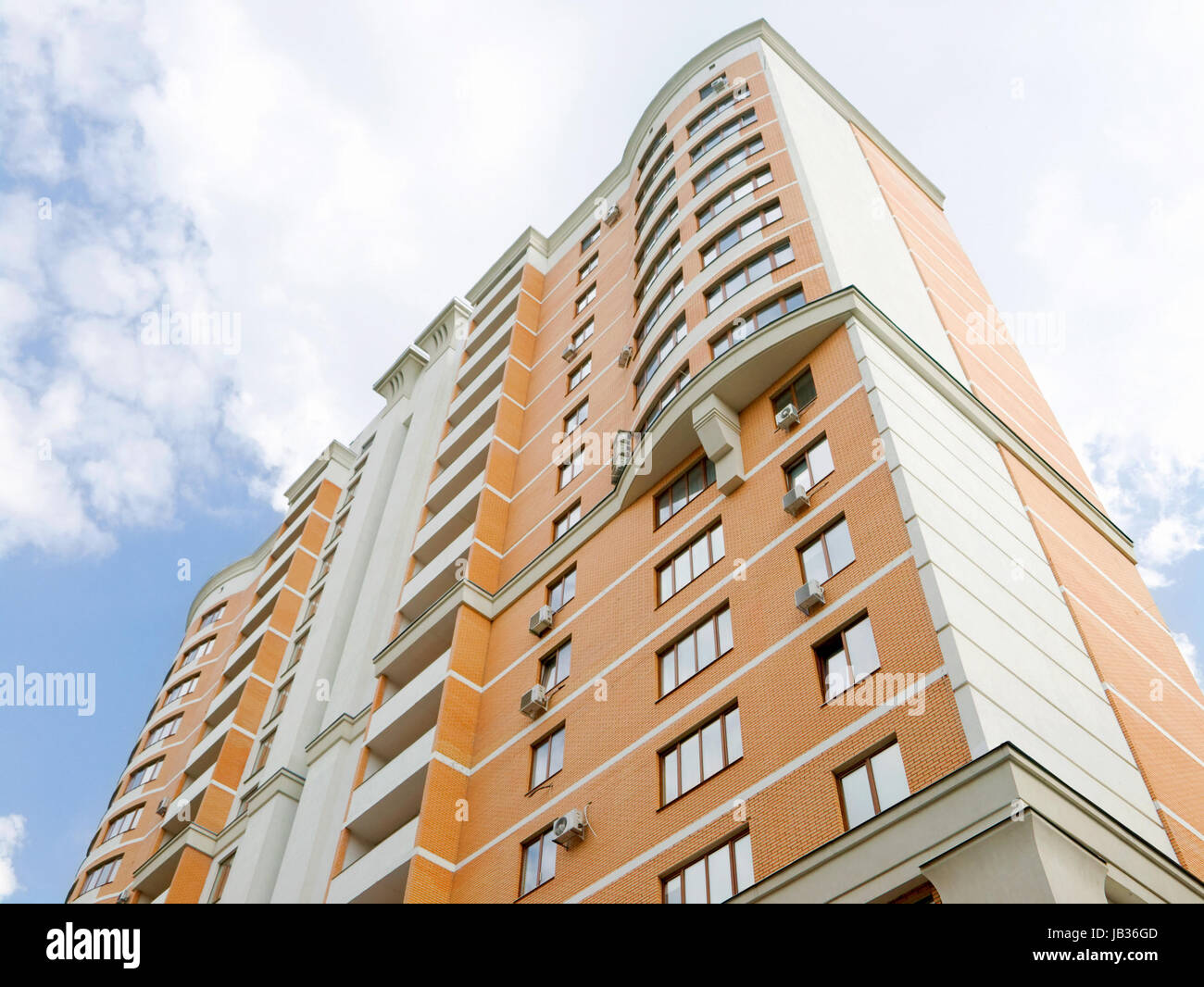 high residential building on a blue background Stock Photo - Alamy