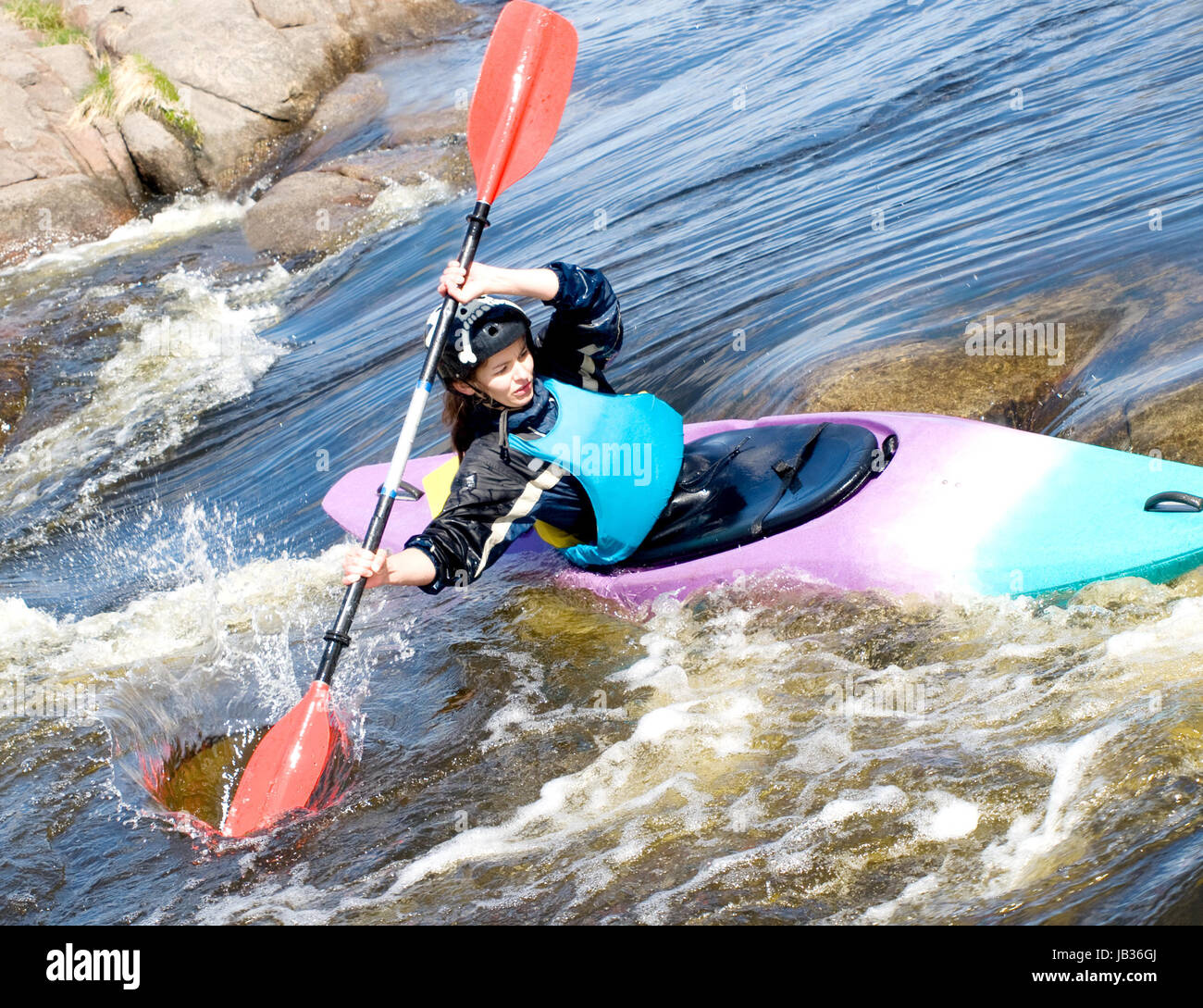 a shot of the female kayaker on the rough water Stock Photo - Alamy