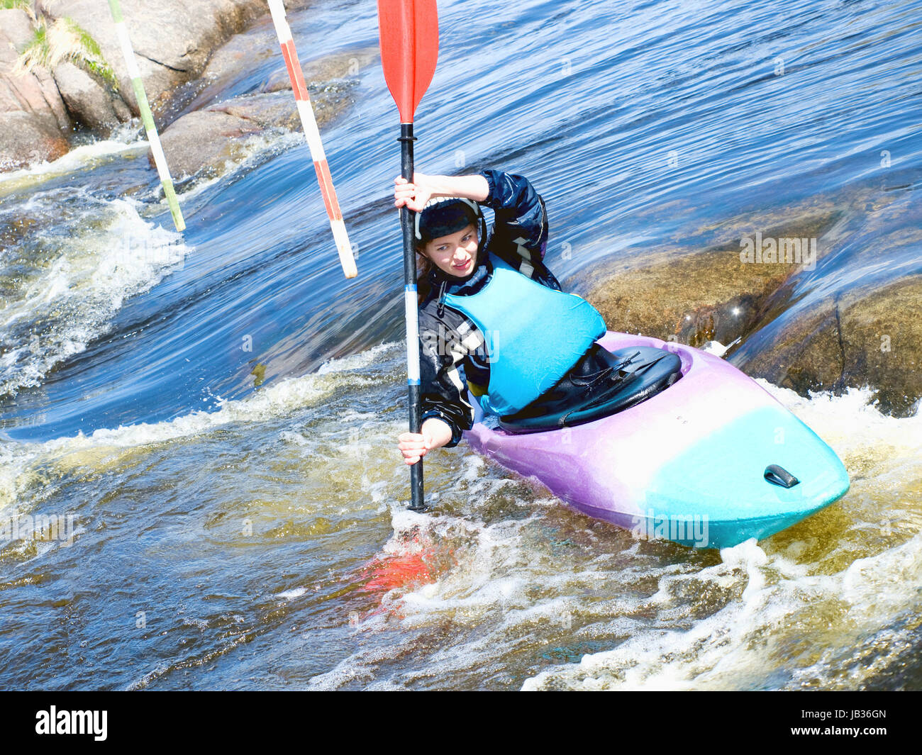 a shot of the female kayaker on the rough water Stock Photo - Alamy