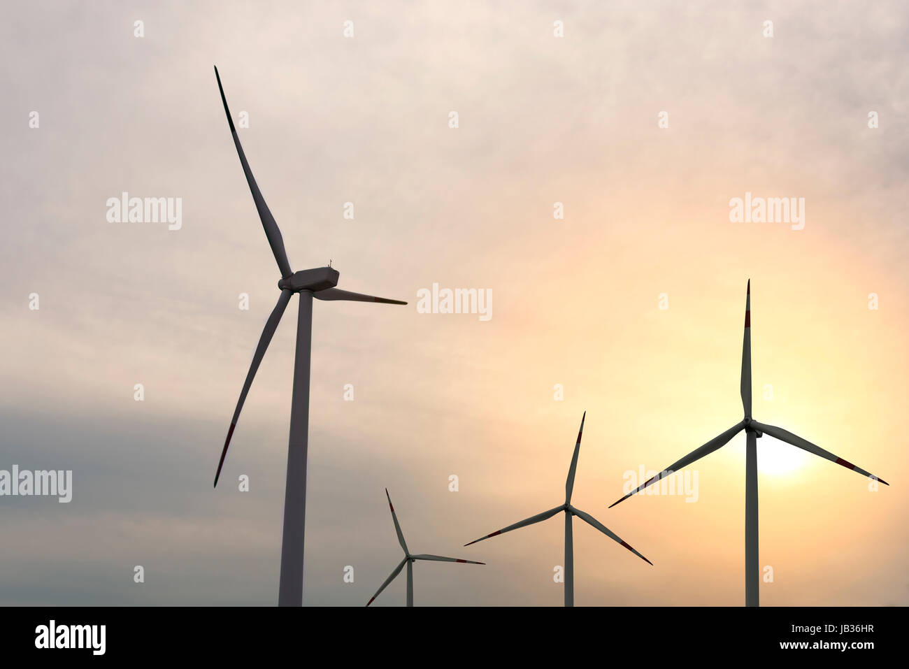 Silhouette of four windmills on sunset Stock Photo - Alamy