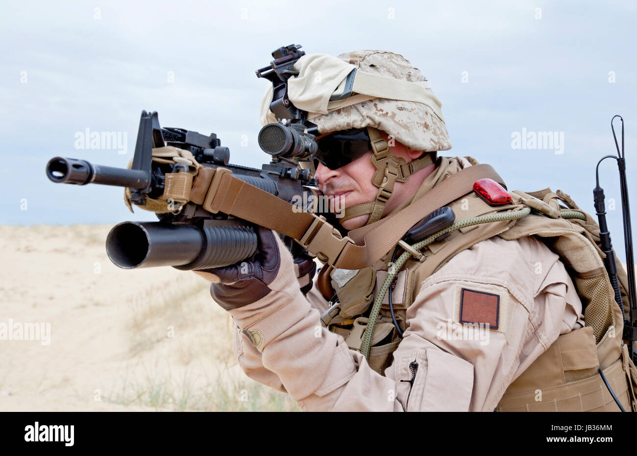 US marine aiming a gun with grenade launcher Stock Photo - Alamy