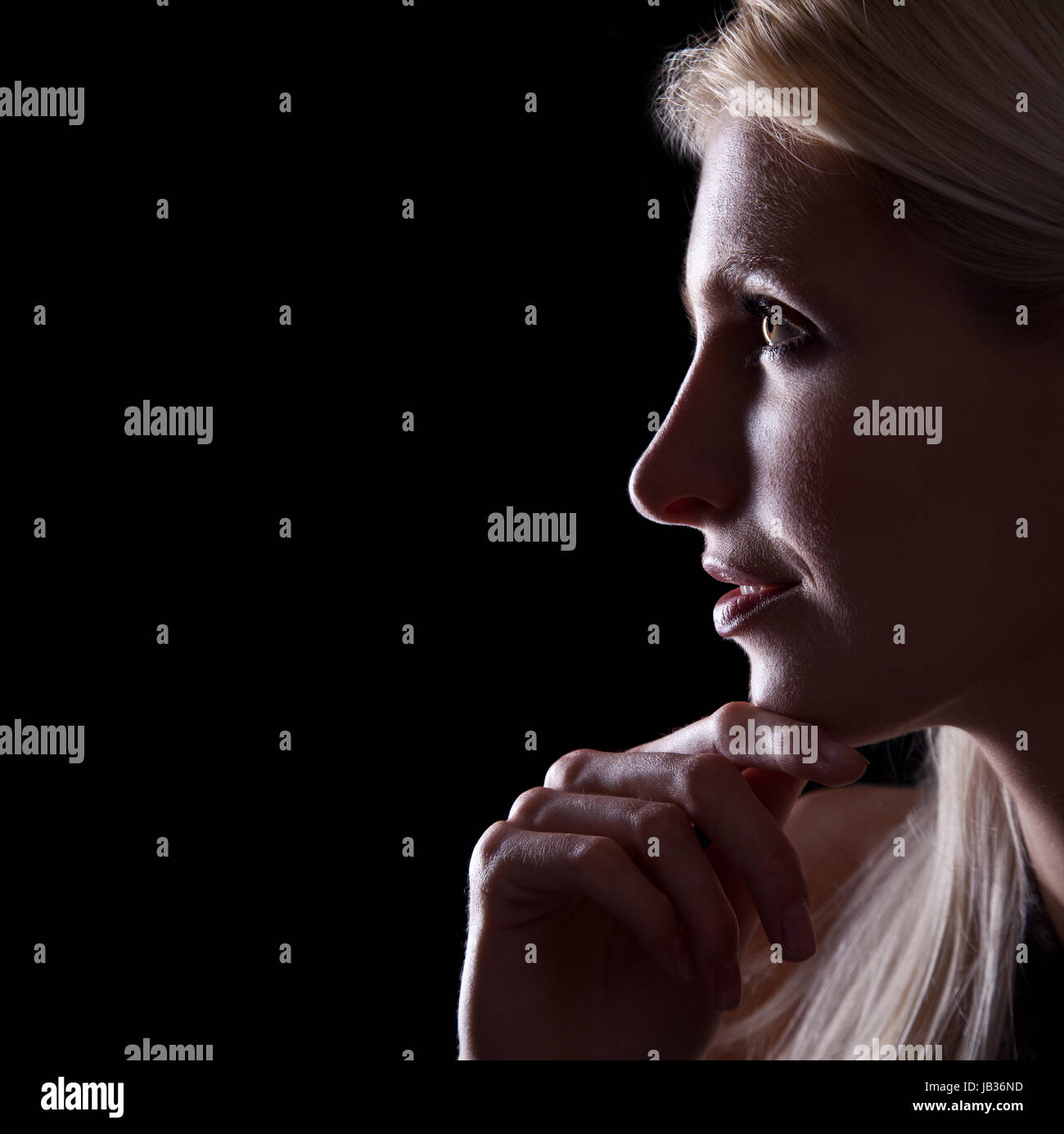 Backlit portrait of caucasian woman profile on black background Stock ...