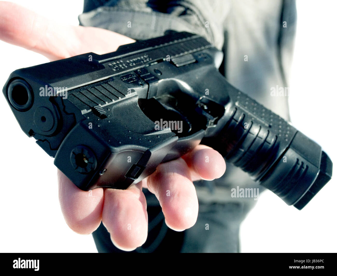man's hand offering the gun Stock Photo - Alamy