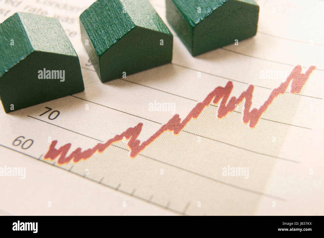 graph in a paper with wooden houses Stock Photo - Alamy