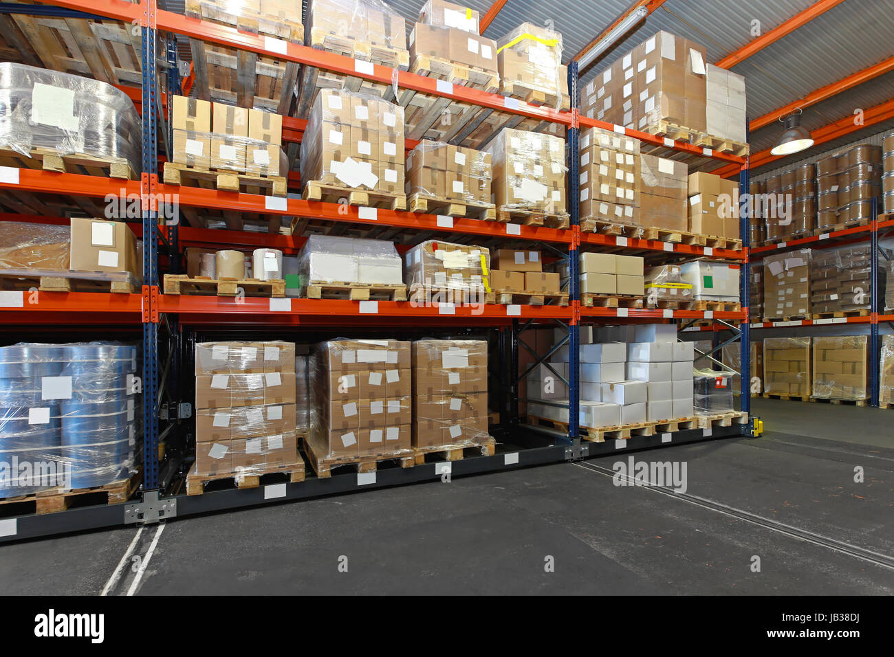 Mobile aisle racking system in distribution warehouse Stock Photo - Alamy
