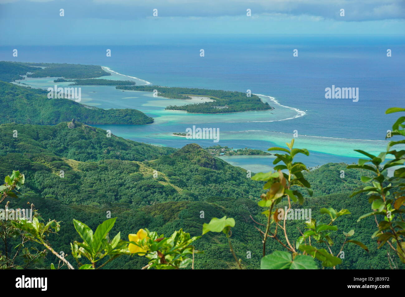 Huahine island coastal landscape, forest with the lagoon and islets ...