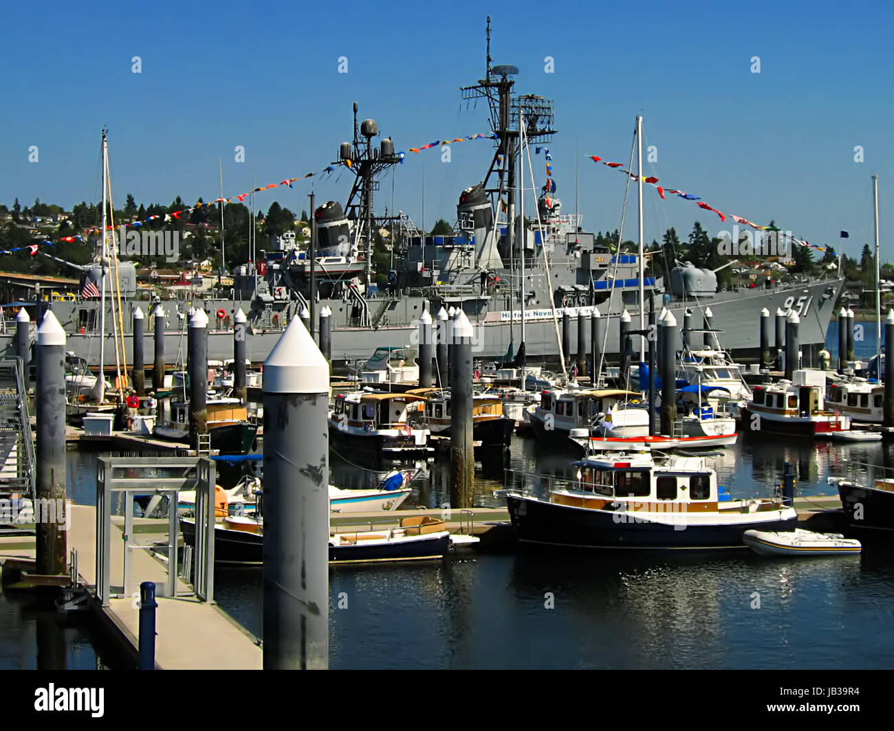 A photograph of a Forrest Sherman-class naval destroyer docked among ...