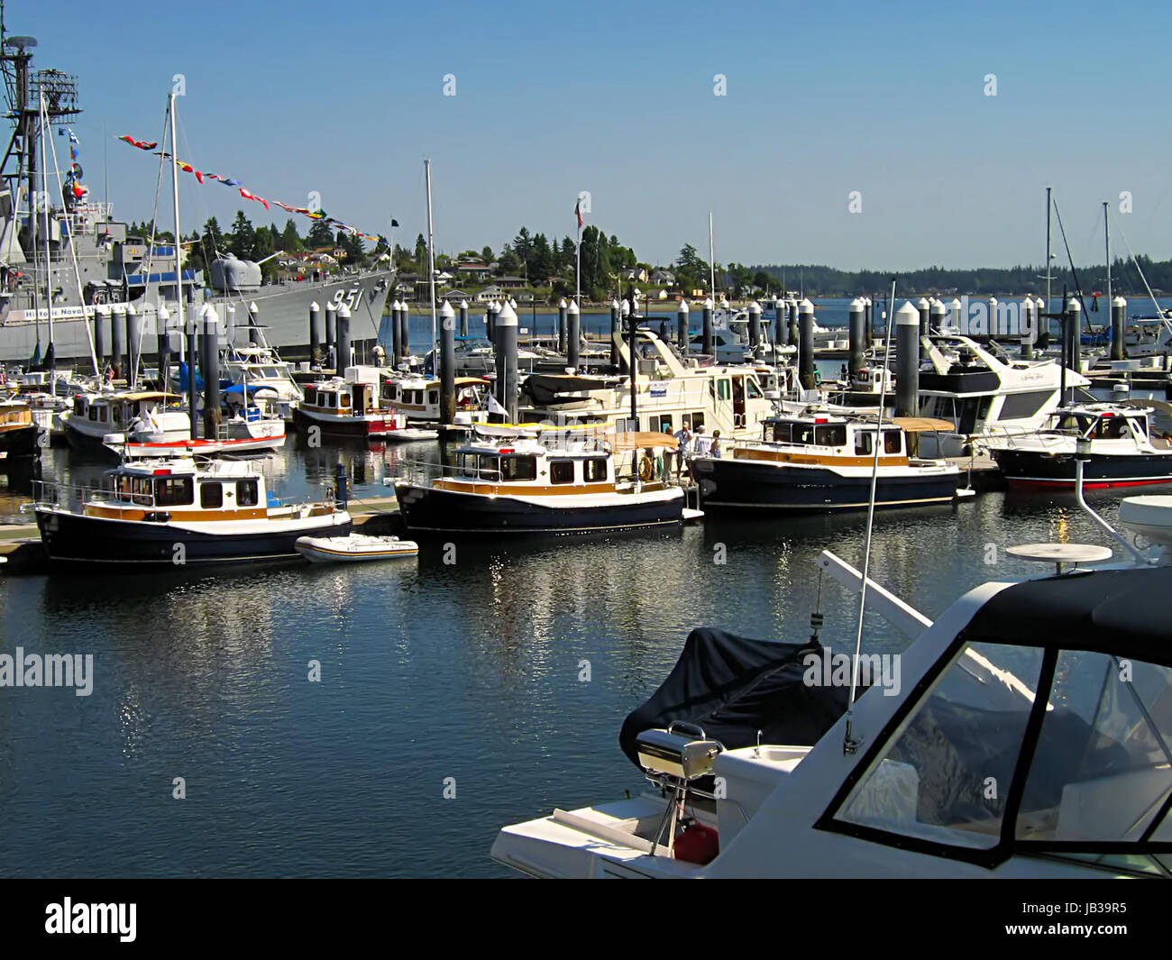 A photograph of a Forrest Sherman-class naval destroyer docked among ...