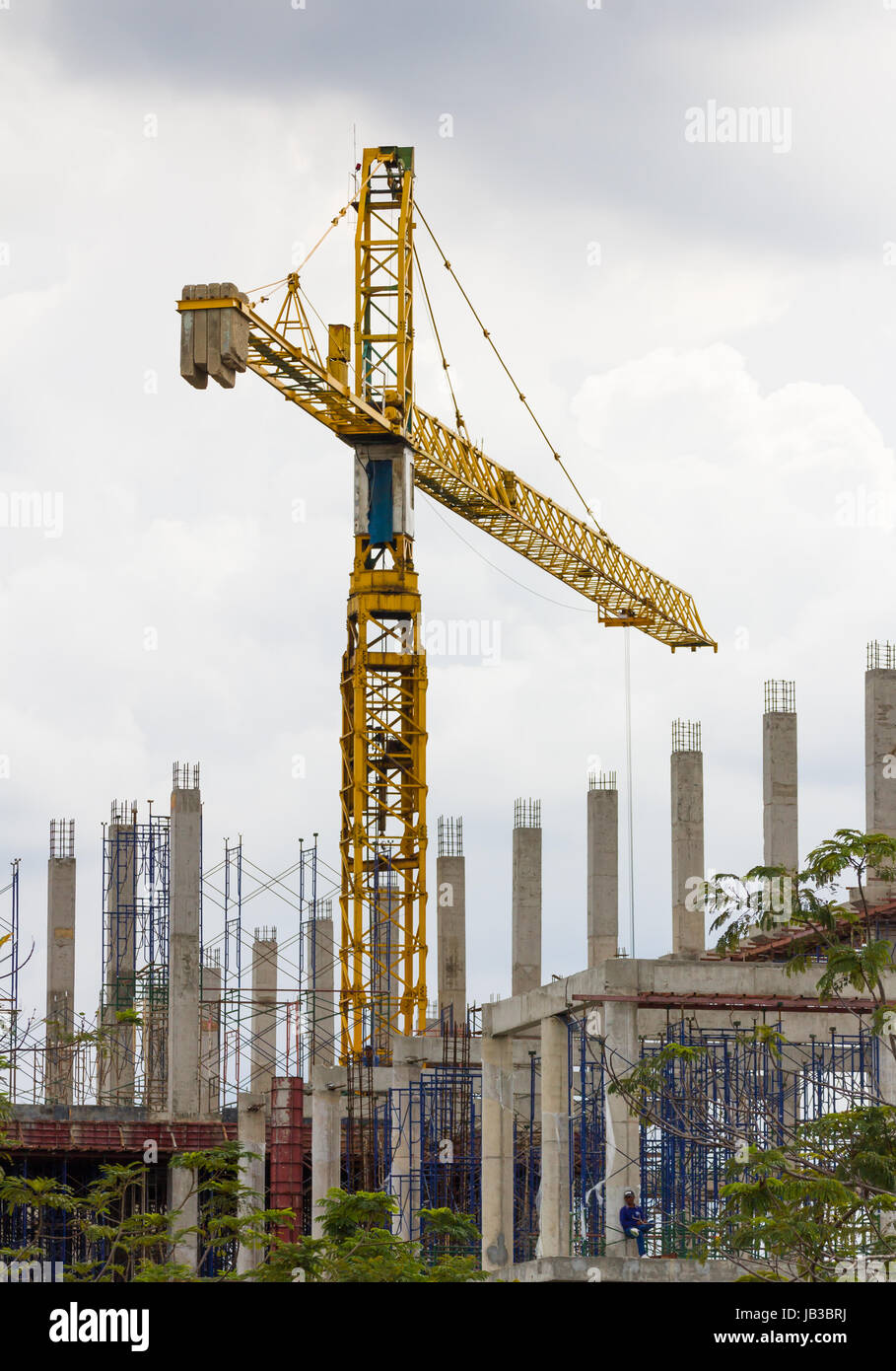 Construction crane and building in construction site Stock Photo - Alamy