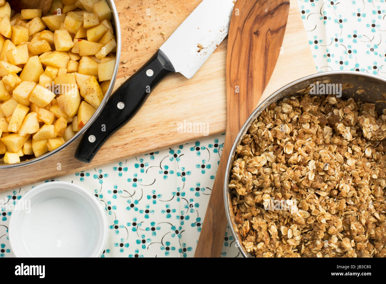 Ingredients and cooking utensils used for making apple crumble Stock ...