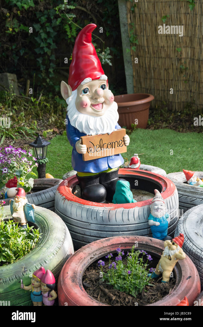 Garden gnome with welcome sign, Overton, Hampshire, England, United ...