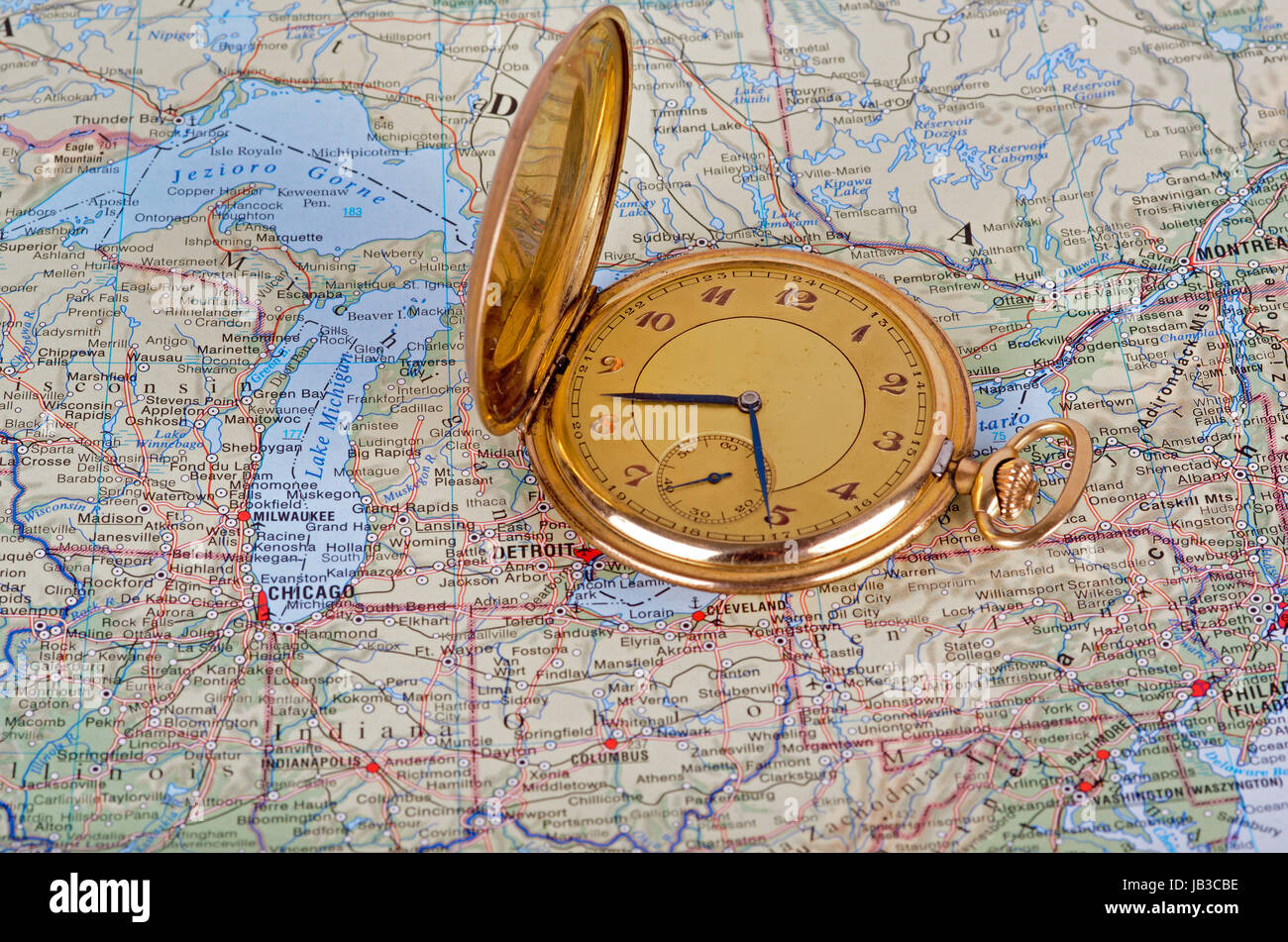 Photo of old watch on map Stock Photo - Alamy