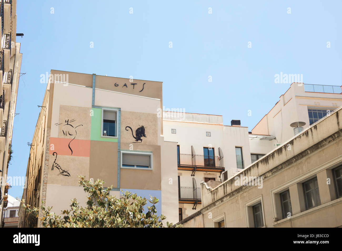 Detail of building's facade with painted cats in Raval, Barcelona ...