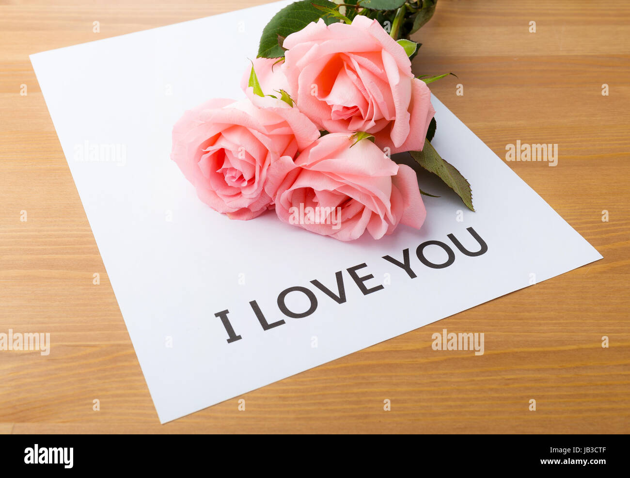 Rose and message card Stock Photo - Alamy
