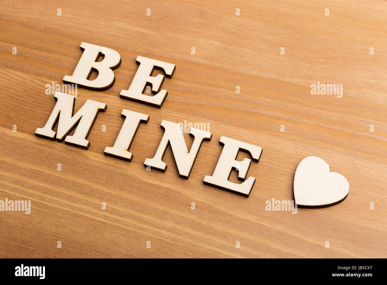 Wooden letters forming be mine Stock Photo - Alamy
