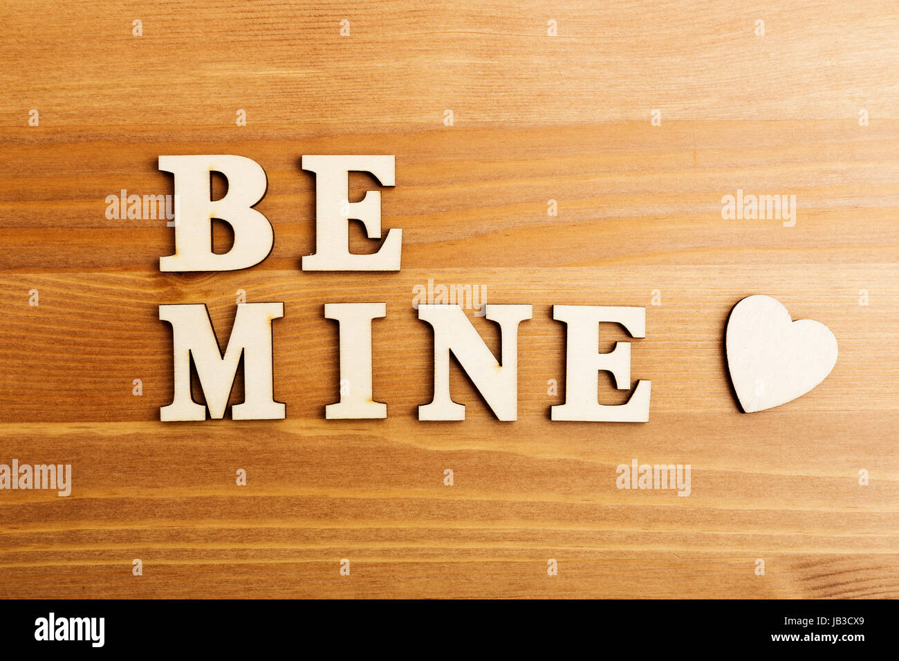 Be mine wooden text Stock Photo - Alamy