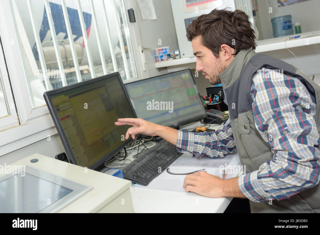 worker checking store stock in computer Stock Photo - Alamy