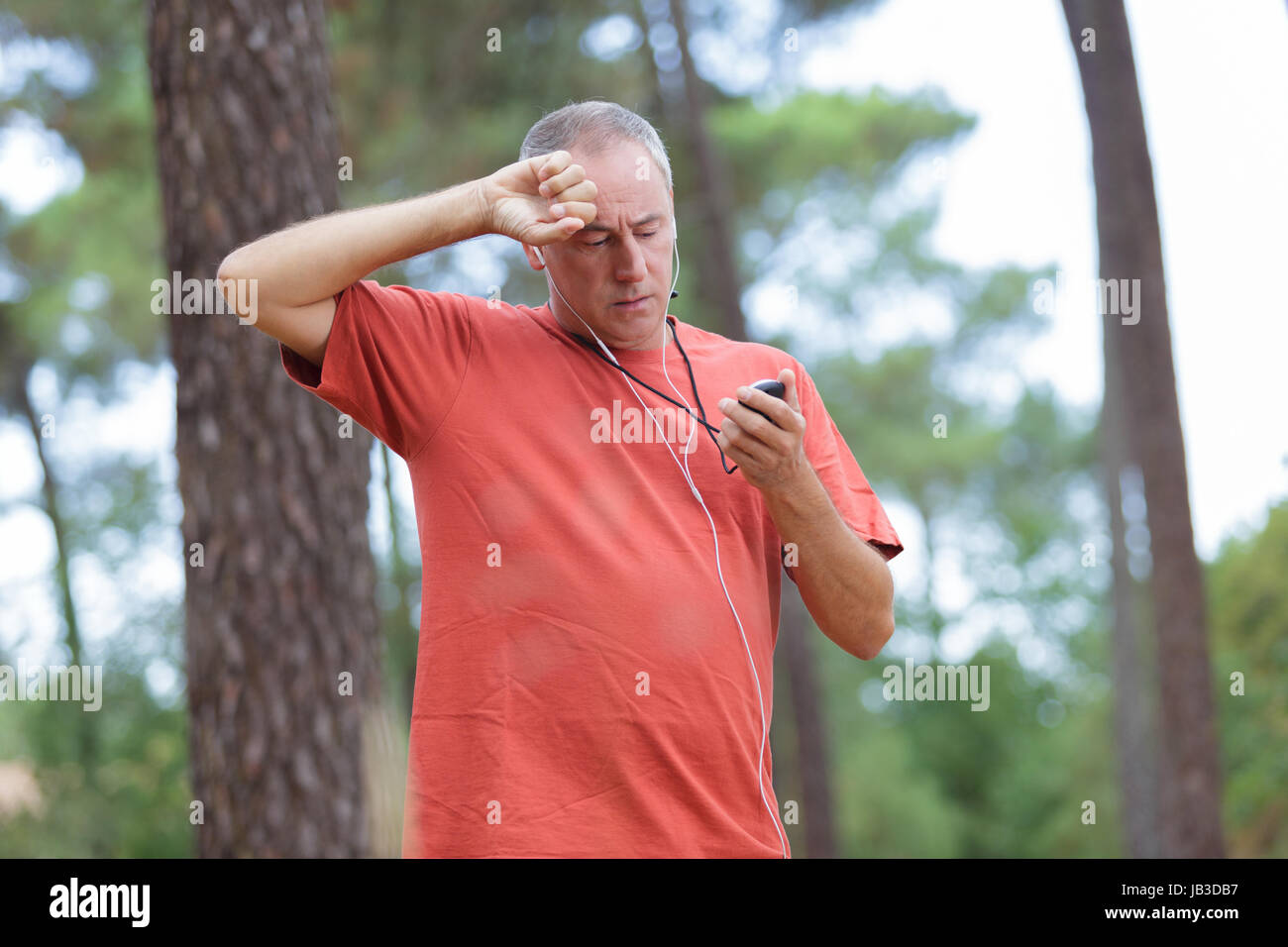 male using sport watch for timing running workout Stock Photo - Alamy