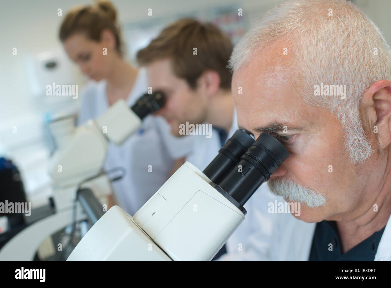 Microbiology scientists studying new hi-res stock photography and ...