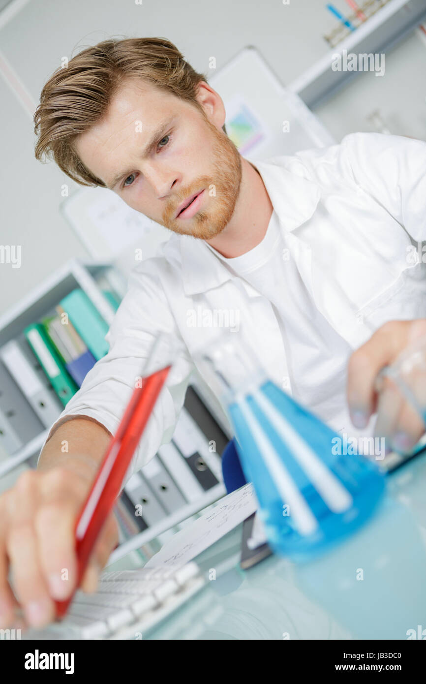male scientist is doing his research Stock Photo - Alamy