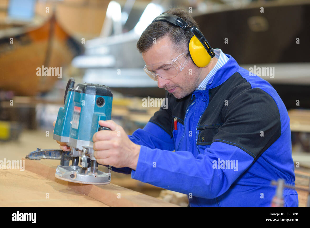 capenter wood sanding at a machine Stock Photo - Alamy