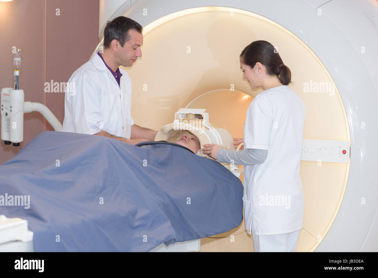 doctors adjusting patients face before mri scan Stock Photo - Alamy