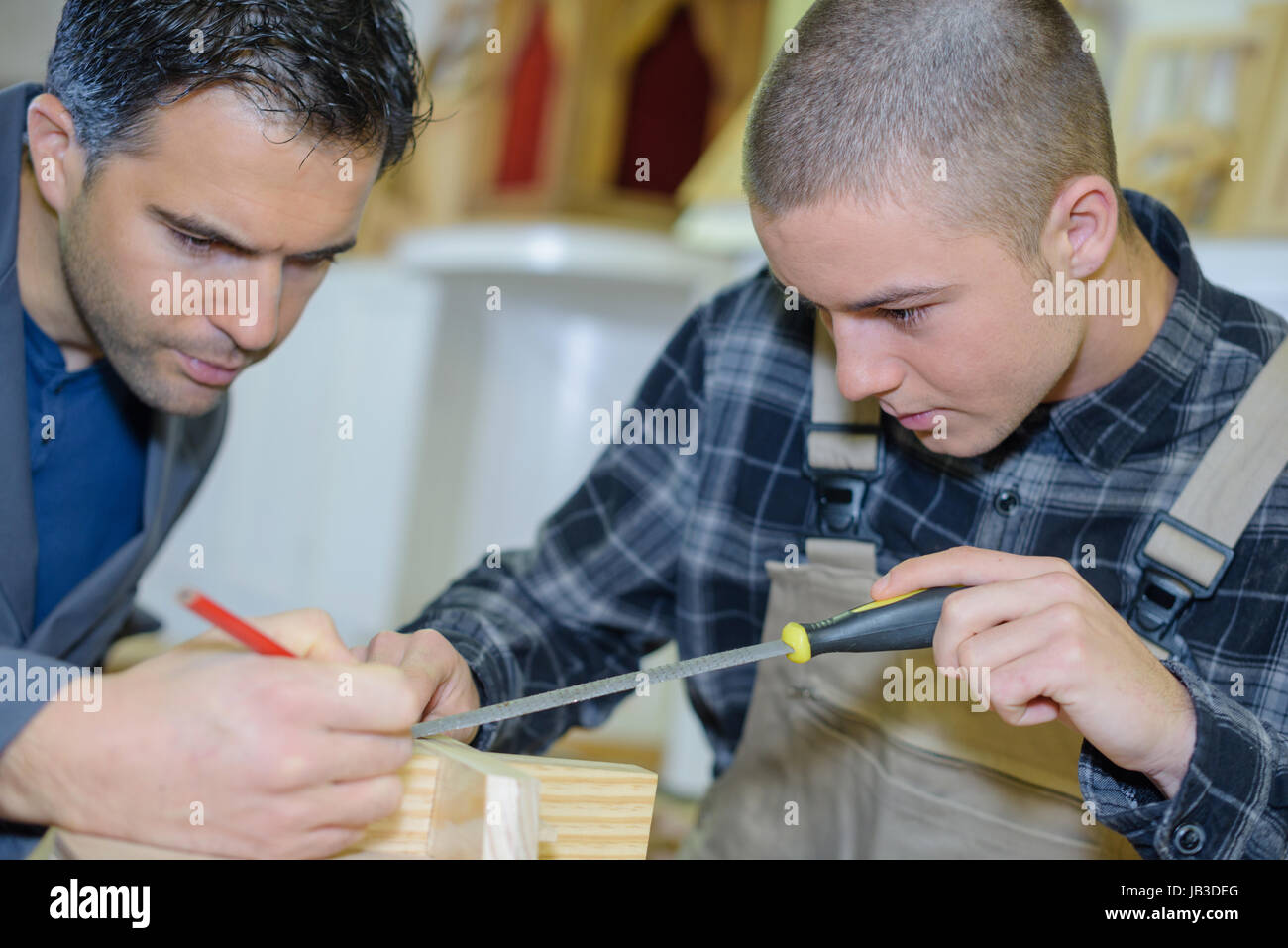 two designers working together in workshop with precision tools Stock ...