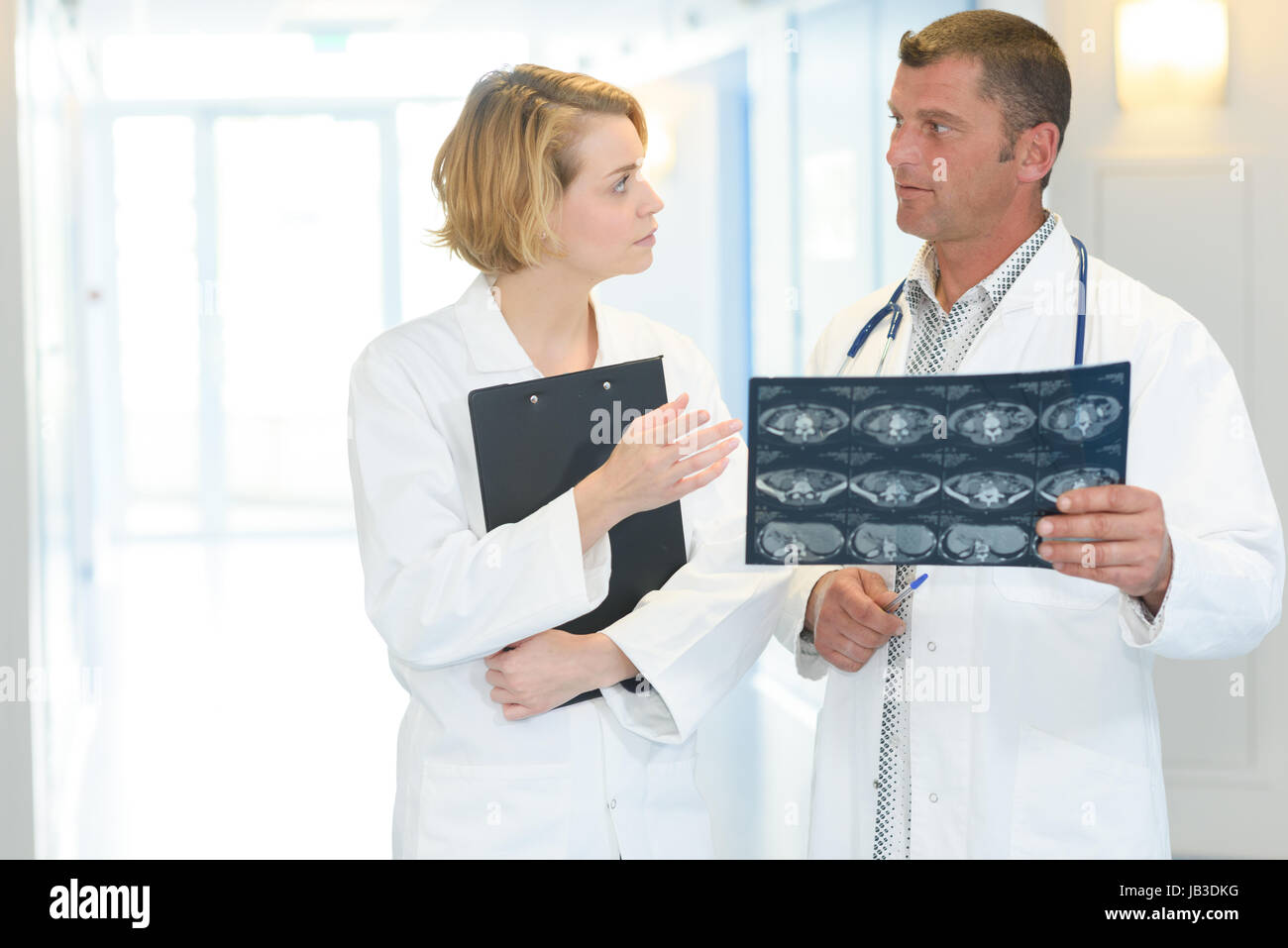 two doctors talking Stock Photo - Alamy