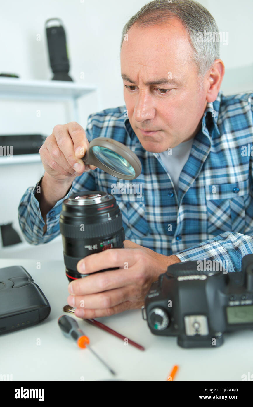 photographer checking his camera equipment Stock Photo - Alamy