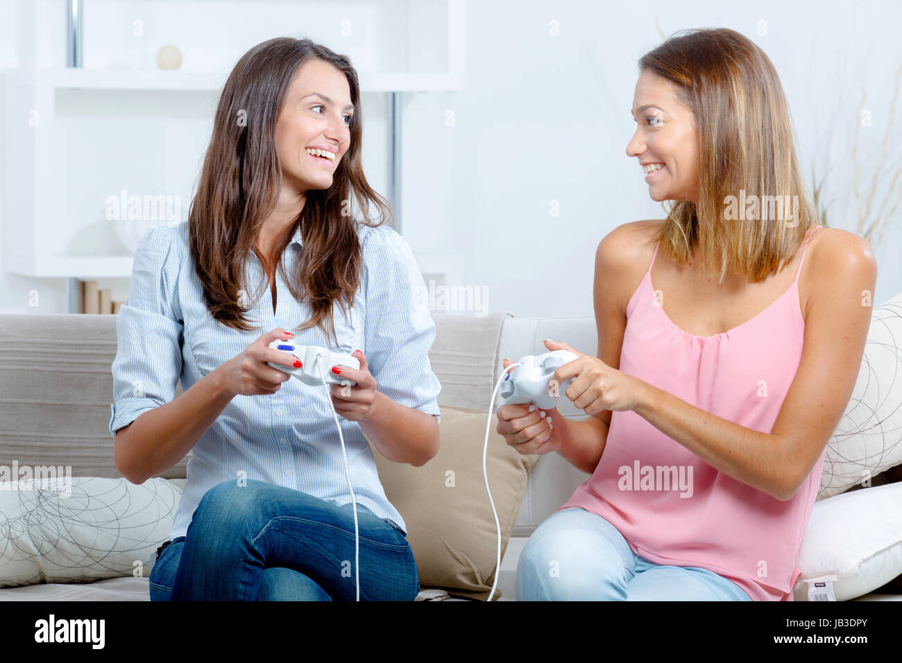 best friends playing video games Stock Photo - Alamy