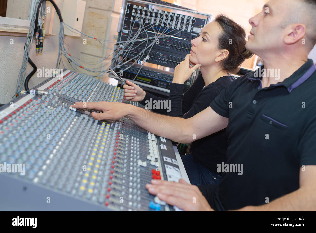 sound engineer and producer working together at recording studio Stock ...