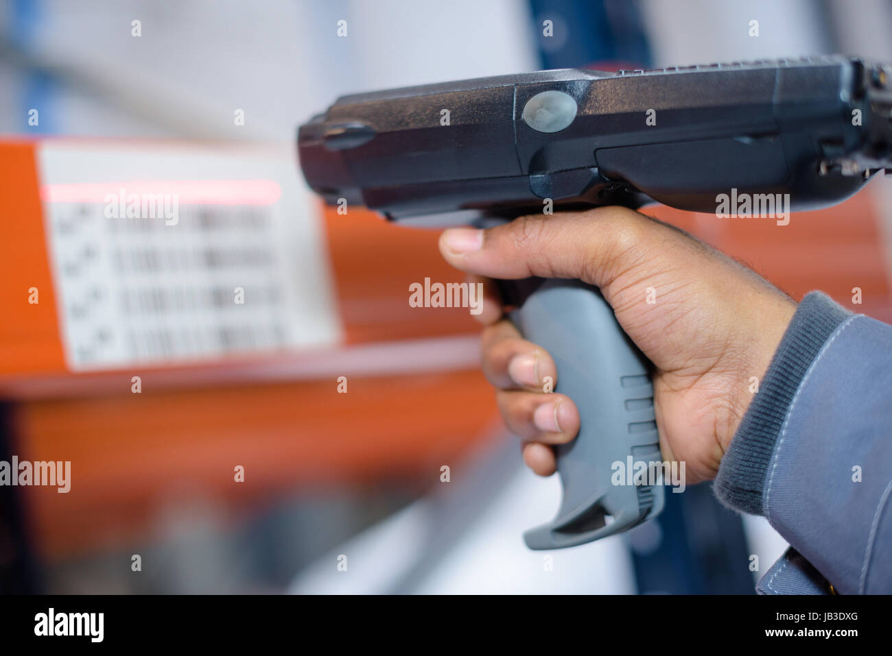 close-up of hand using barcode scanner Stock Photo - Alamy
