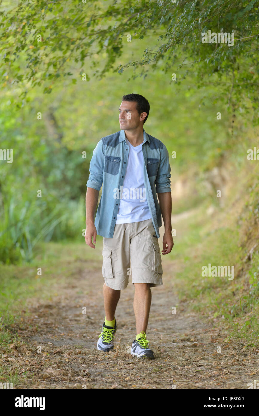 happy man walking and relaxing in park Stock Photo - Alamy