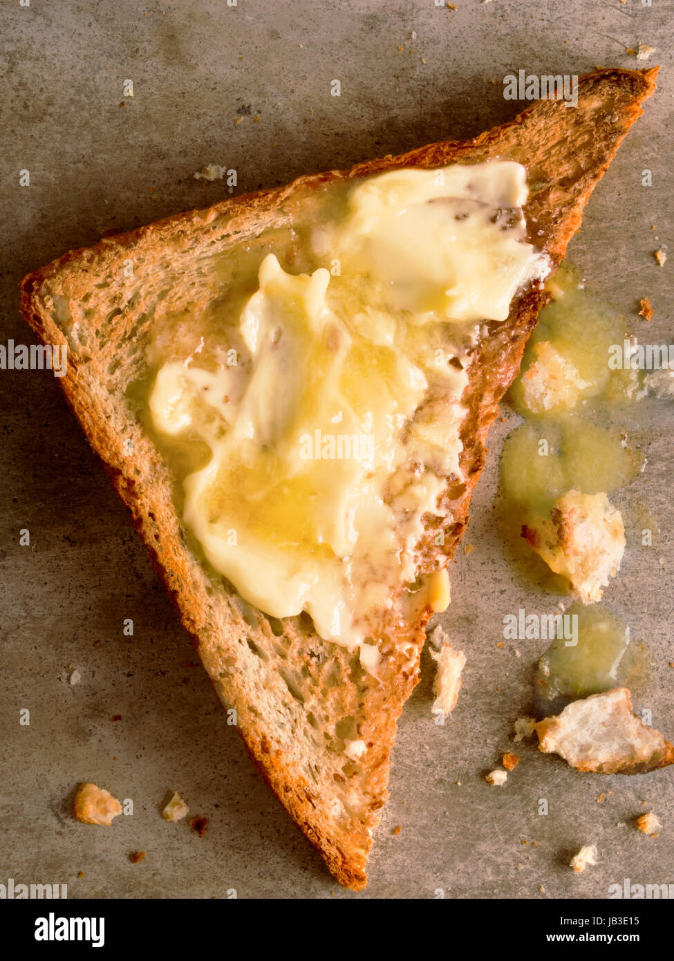close up of a slice of toast with melted butter Stock Photo - Alamy