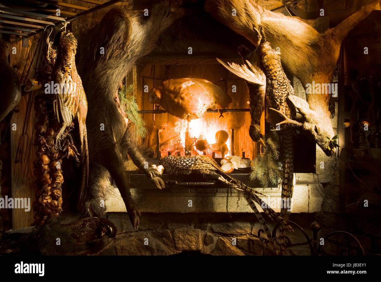 Venison hanging at a fireplace Stock Photo - Alamy