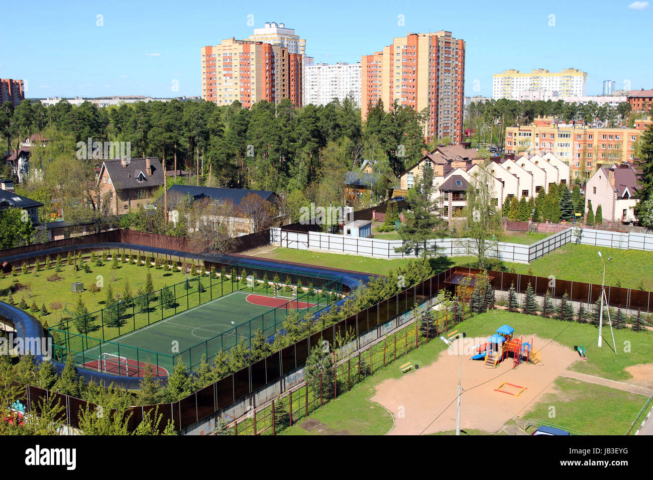 A view of a residential area with different types of buildings, an ...