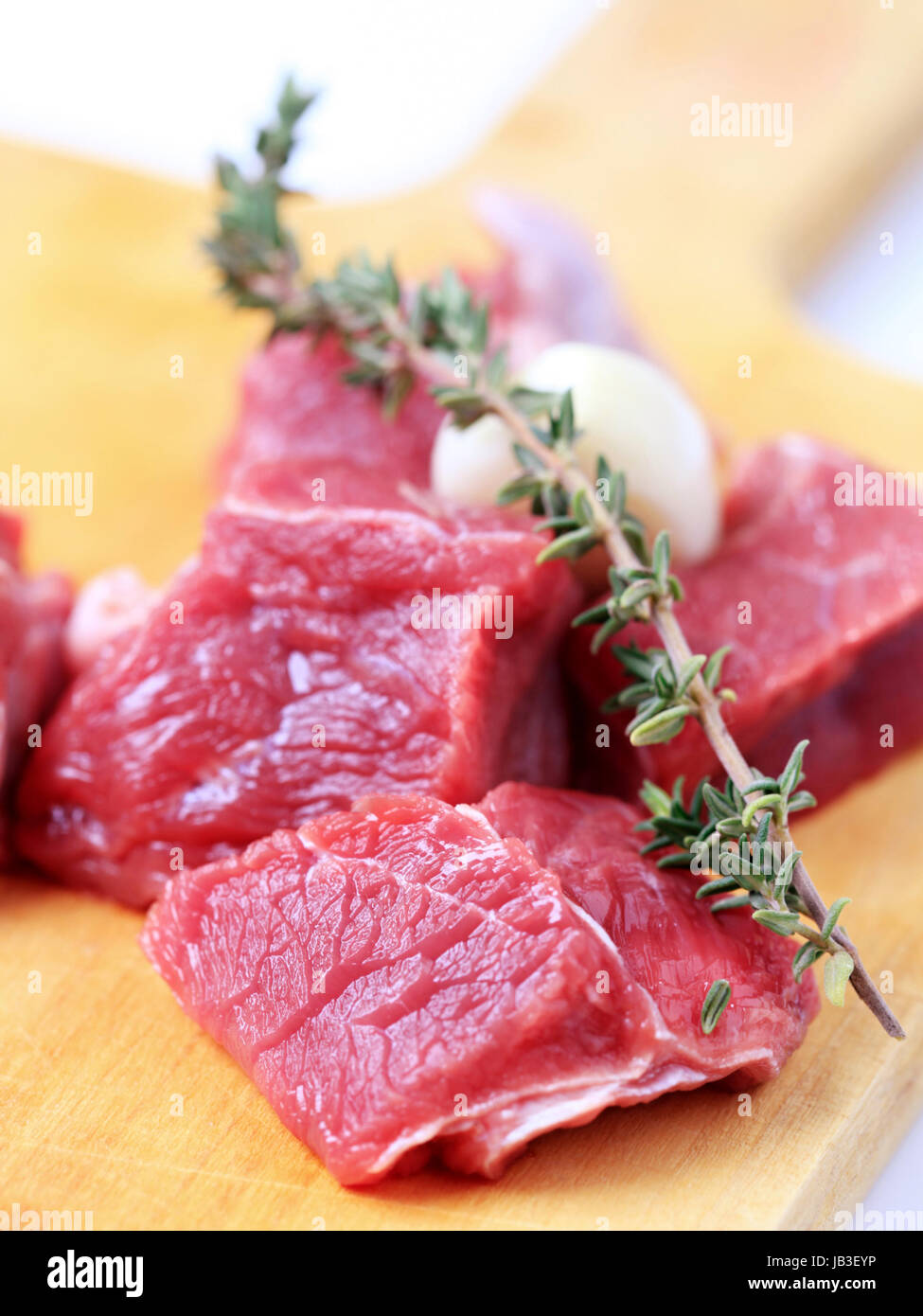 Chunks of beef meat on a cutting board Stock Photo - Alamy